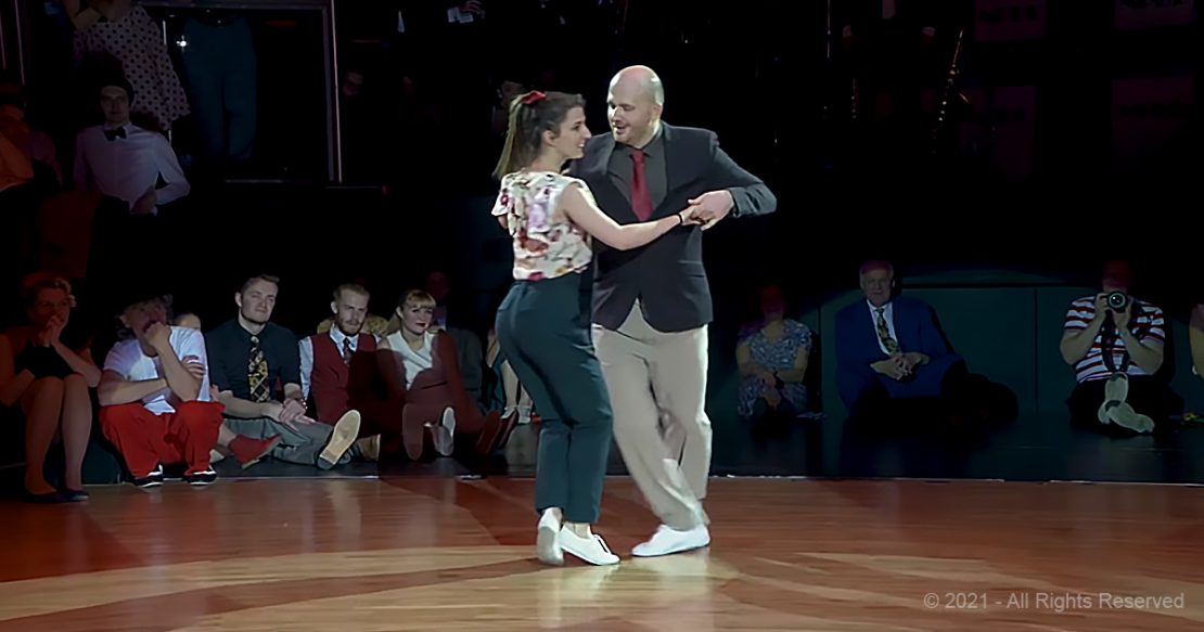 She grabs his hand to dance and the crowd goes wild with their swinging ...