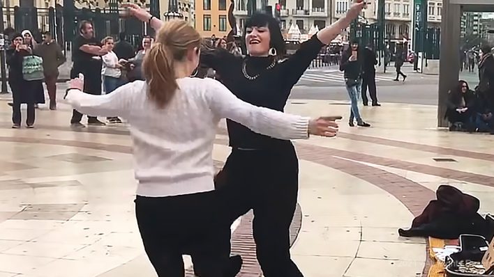 She grabs his hand to dance and the crowd goes wild with their swinging ...