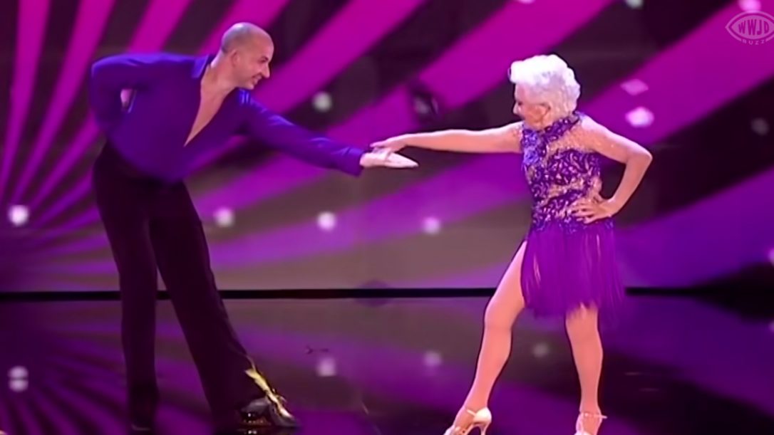 She grabs his hand to dance and the crowd goes wild with their swinging ...