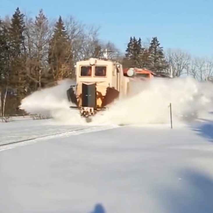 Spectacular footage of trains busting through white walls of snow | WWJD